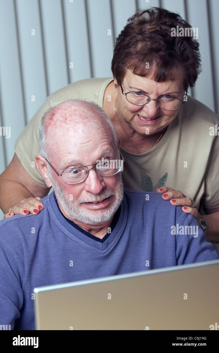 Senior Adults on Working on a Laptop Computer Stock Photo - Alamy