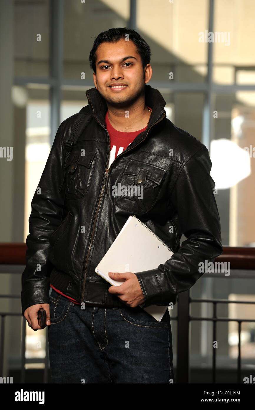 Portrait of Indian student smiling in a university setting Stock Photo ...