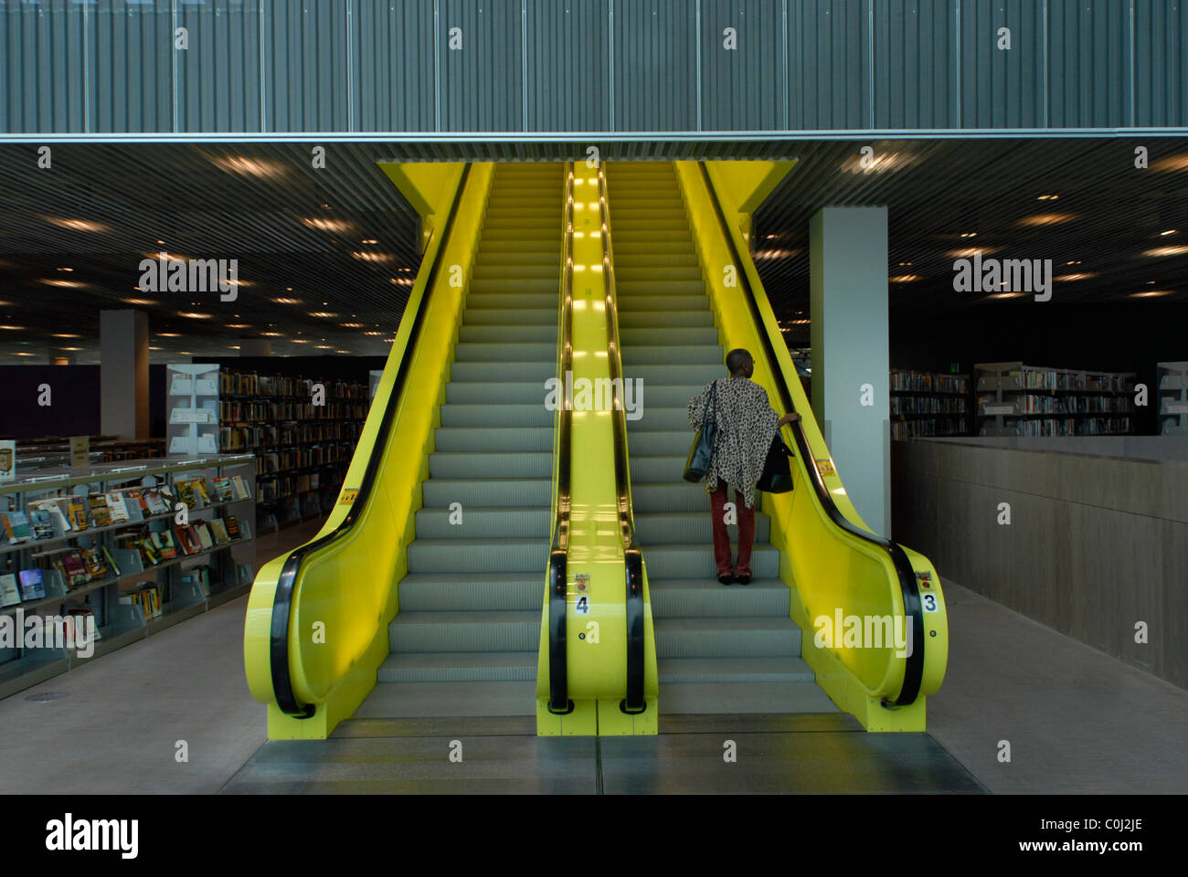Woman on escalator in Seattle's Central Library, Washington State, USA ...