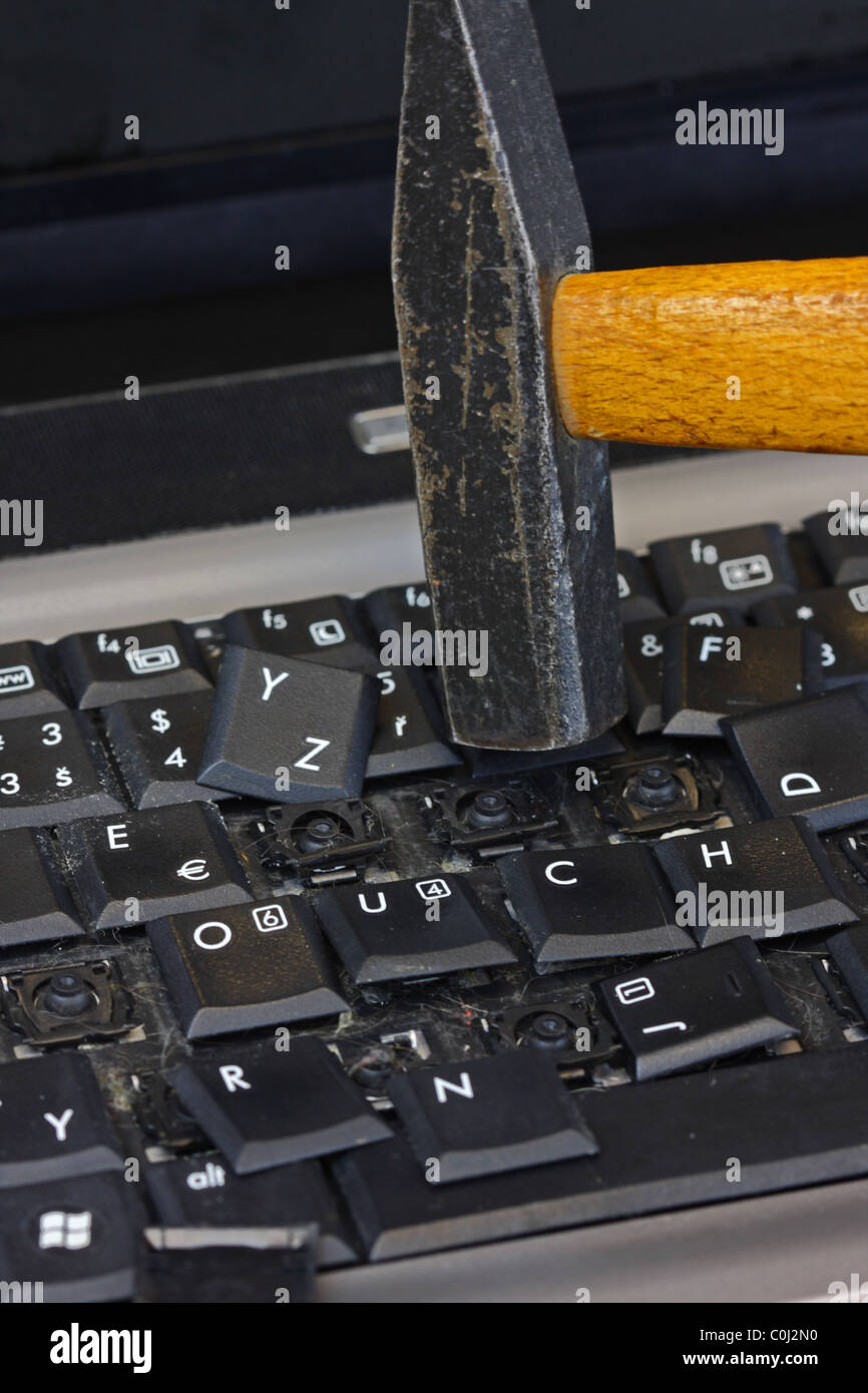 Laptop keybord in pain, typing "ouch Stock Photo - Alamy