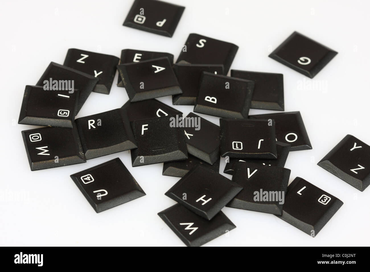 Scattered keyboard letters on white background Stock Photo - Alamy