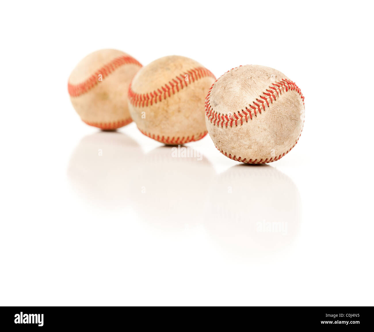 Three Baseballs Isolated on a Reflective White Background Stock Photo ...
