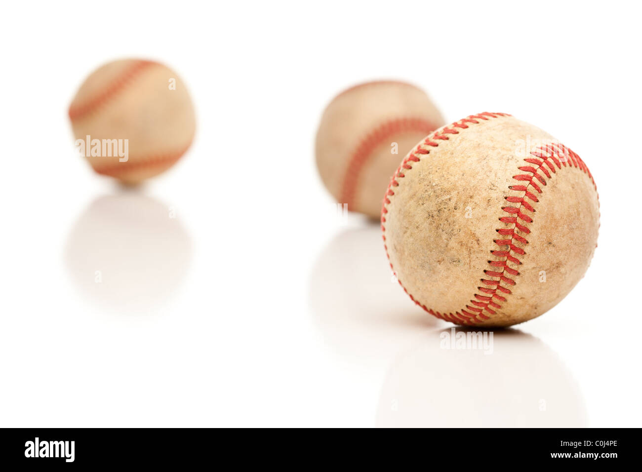 Three Baseballs Isolated on a Reflective White Background Stock Photo ...