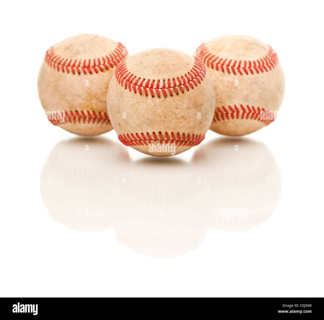 Three Baseballs Isolated on a Reflective White Background Stock Photo ...