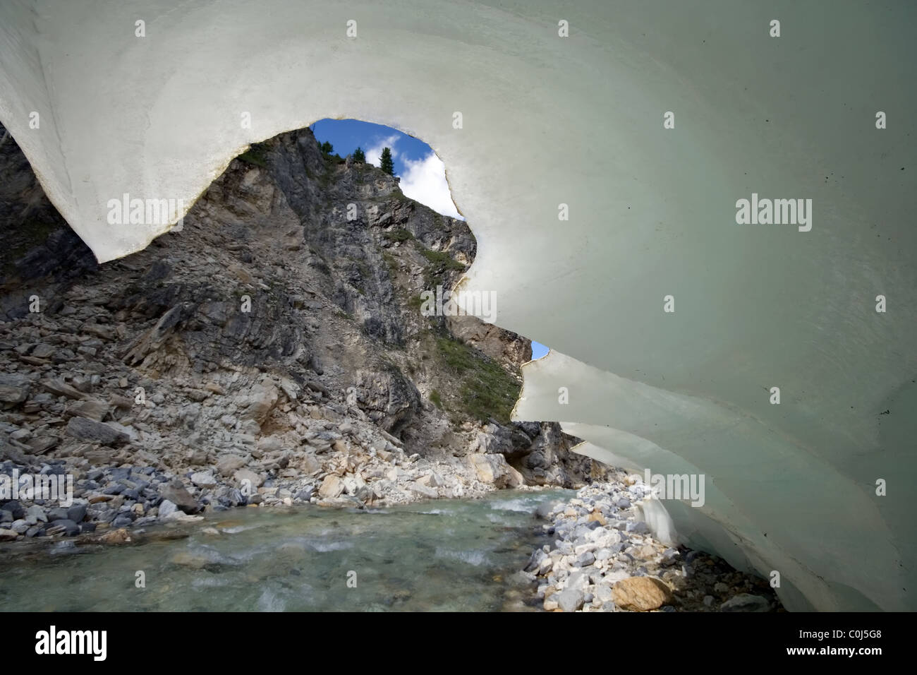 Fantastic wavy ice shape (glacier) near river in East Sayan mountains ...