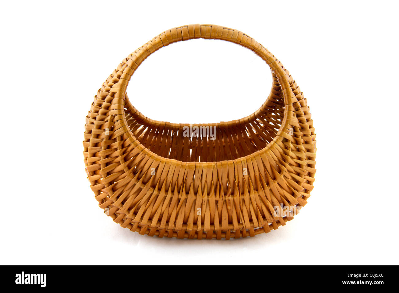Empty wicker cane basket on white background Stock Photo - Alamy