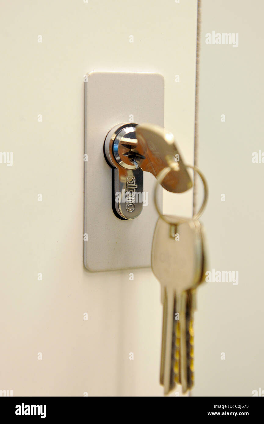 Keys in a lock Stock Photo - Alamy