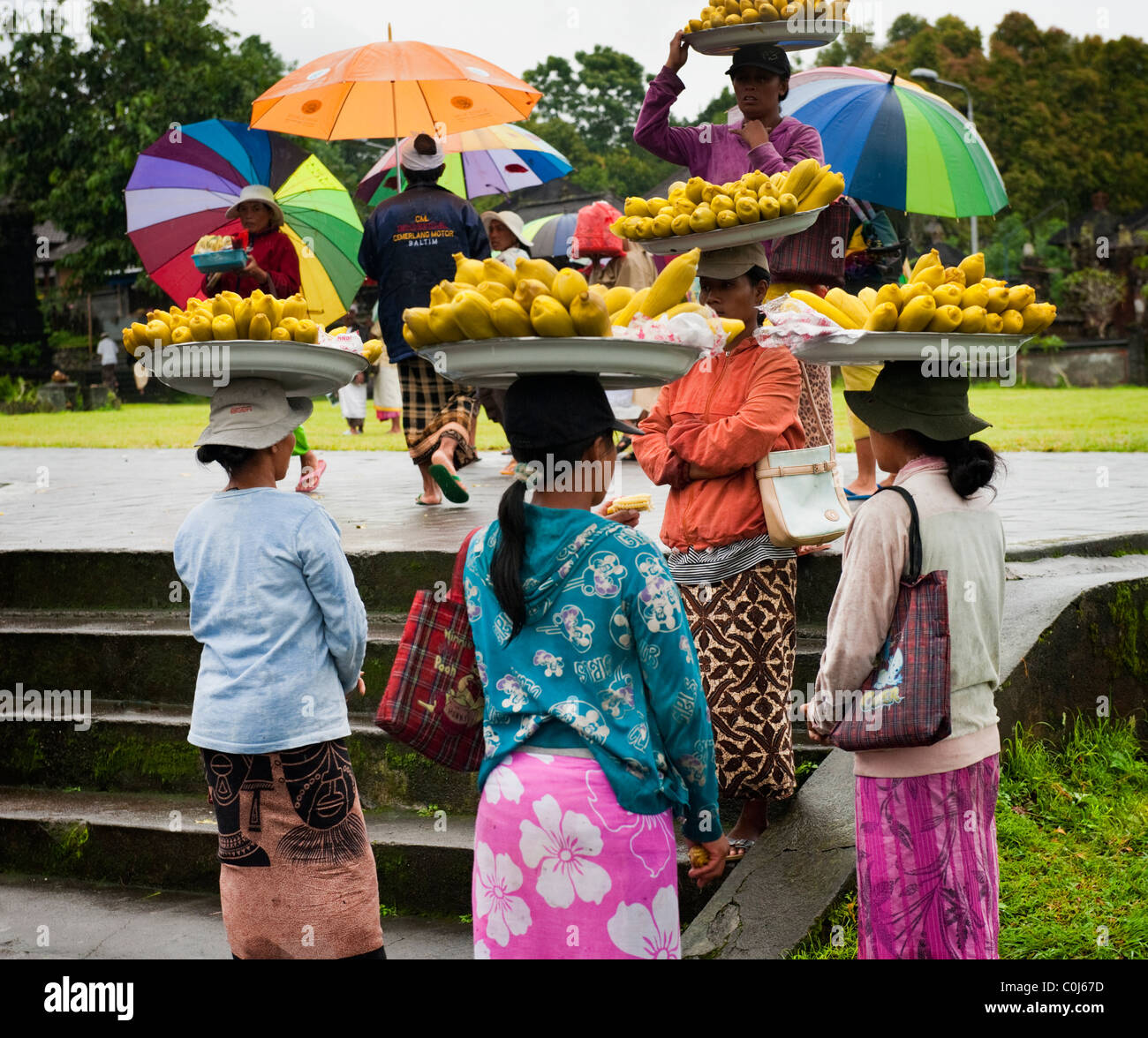 Ladies selling corn on the cob for snacks at the Hindu "Mother Temple ...