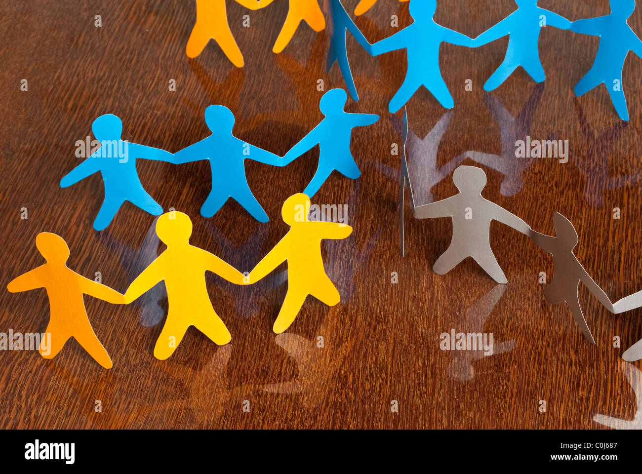 Group paper doll holding hands hi-res stock photography and images - Alamy