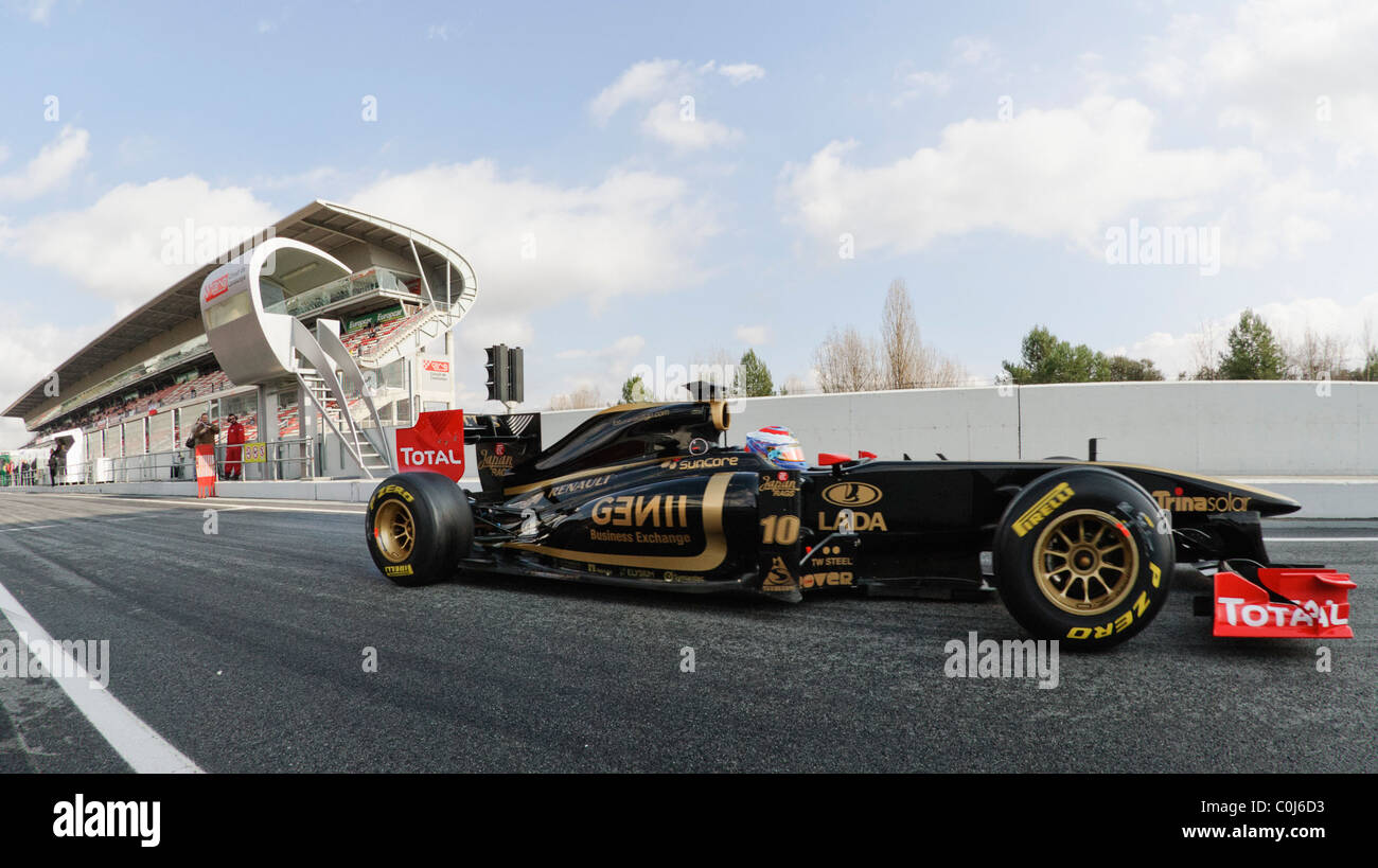 Vitaly Petrov (RUS) in the Renault R31 Formula One racecar in front of ...