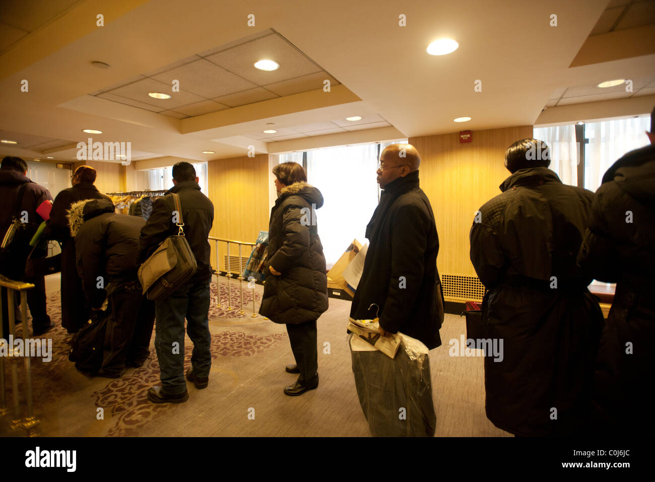 Job seekers line up for a job fair in midtown in New York on Wednesday ...