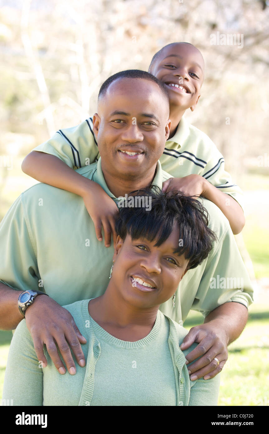 Attractive African American Man, Woman and Child posing in the park ...