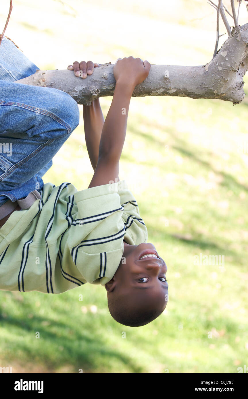 African boy climbing tree hi-res stock photography and images - Alamy