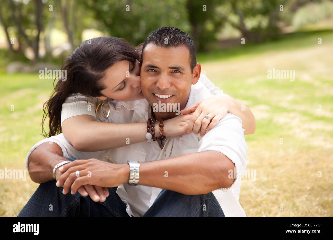 Affectionate Happy Hispanic Couple in the Park Stock Photo - Alamy