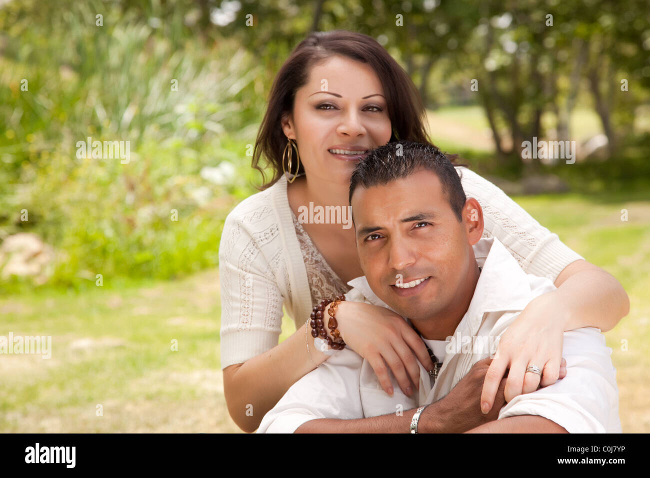 Attractive Hispanic Couple Portrait in the Park Stock Photo - Alamy