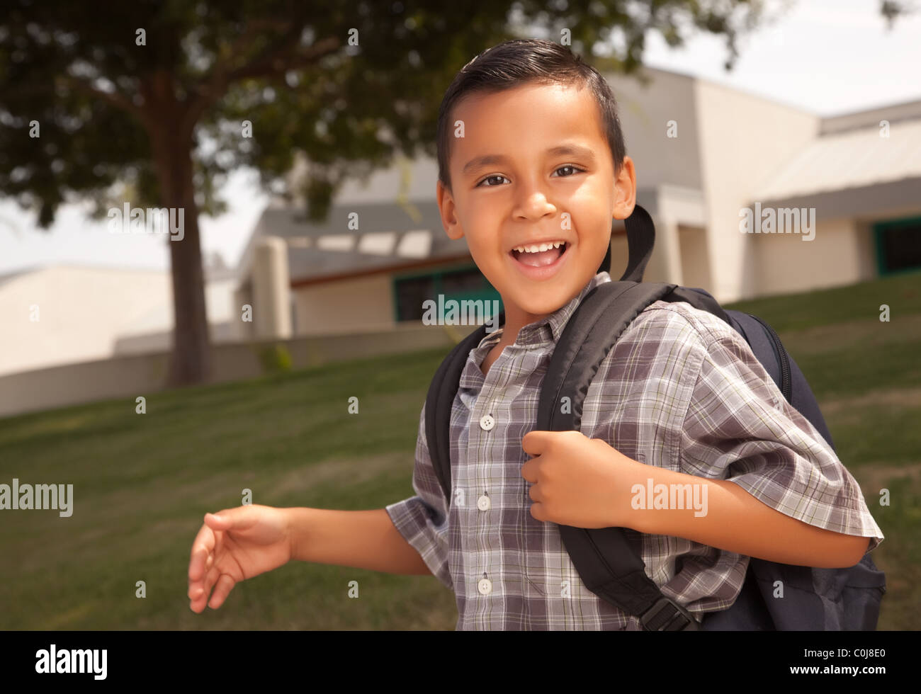 Happy Young Hispanic Boy with Backpack Ready for School Stock Photo - Alamy