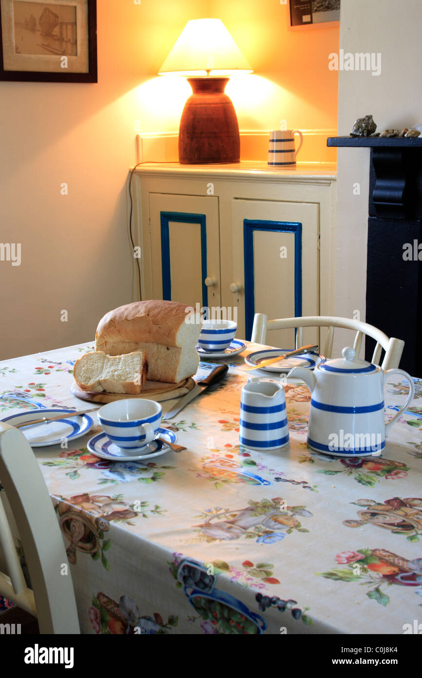 Breakfast table with bread and tea cups Stock Photo - Alamy