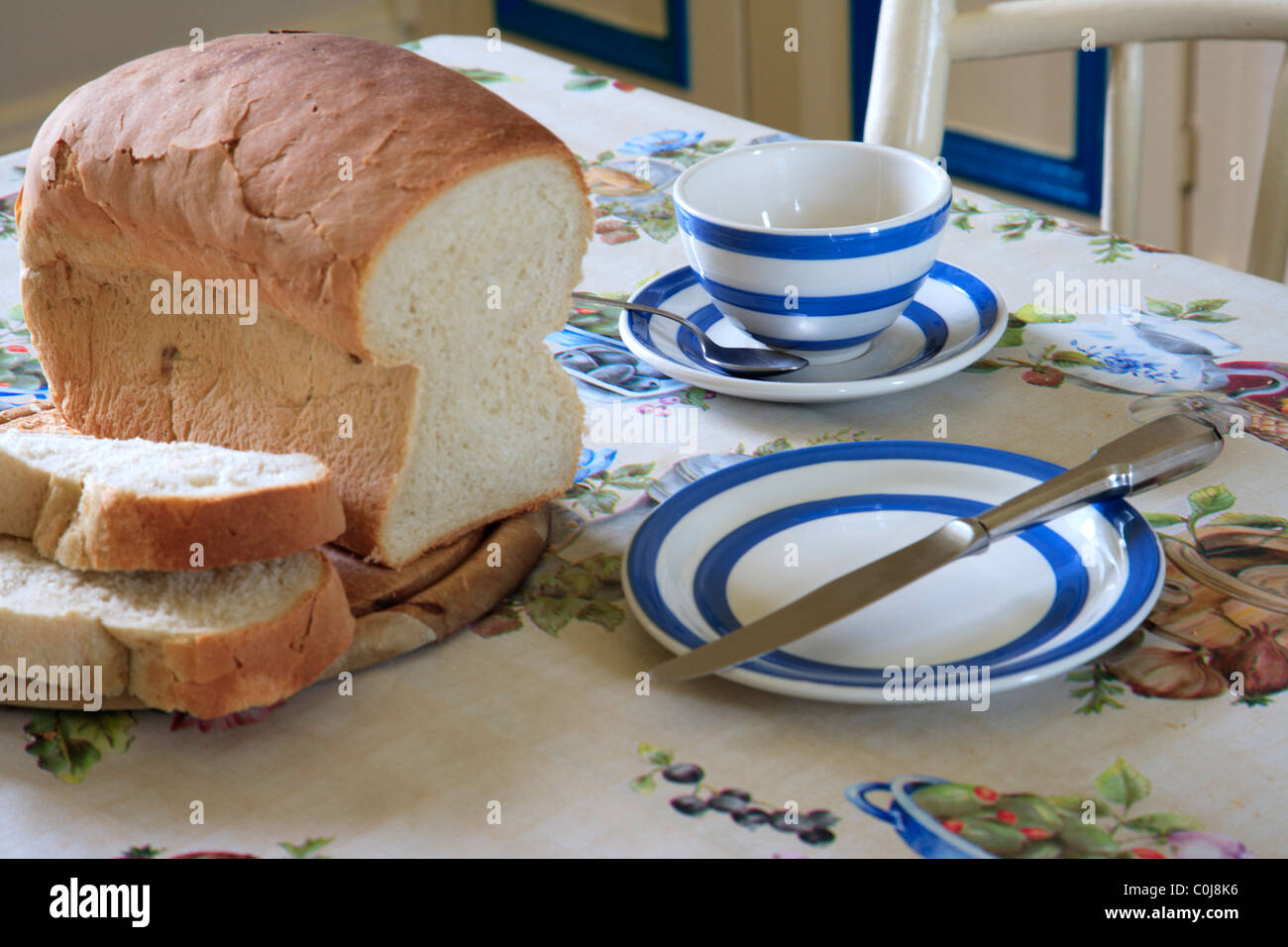 Breakfast table with bread and tea cups Stock Photo - Alamy