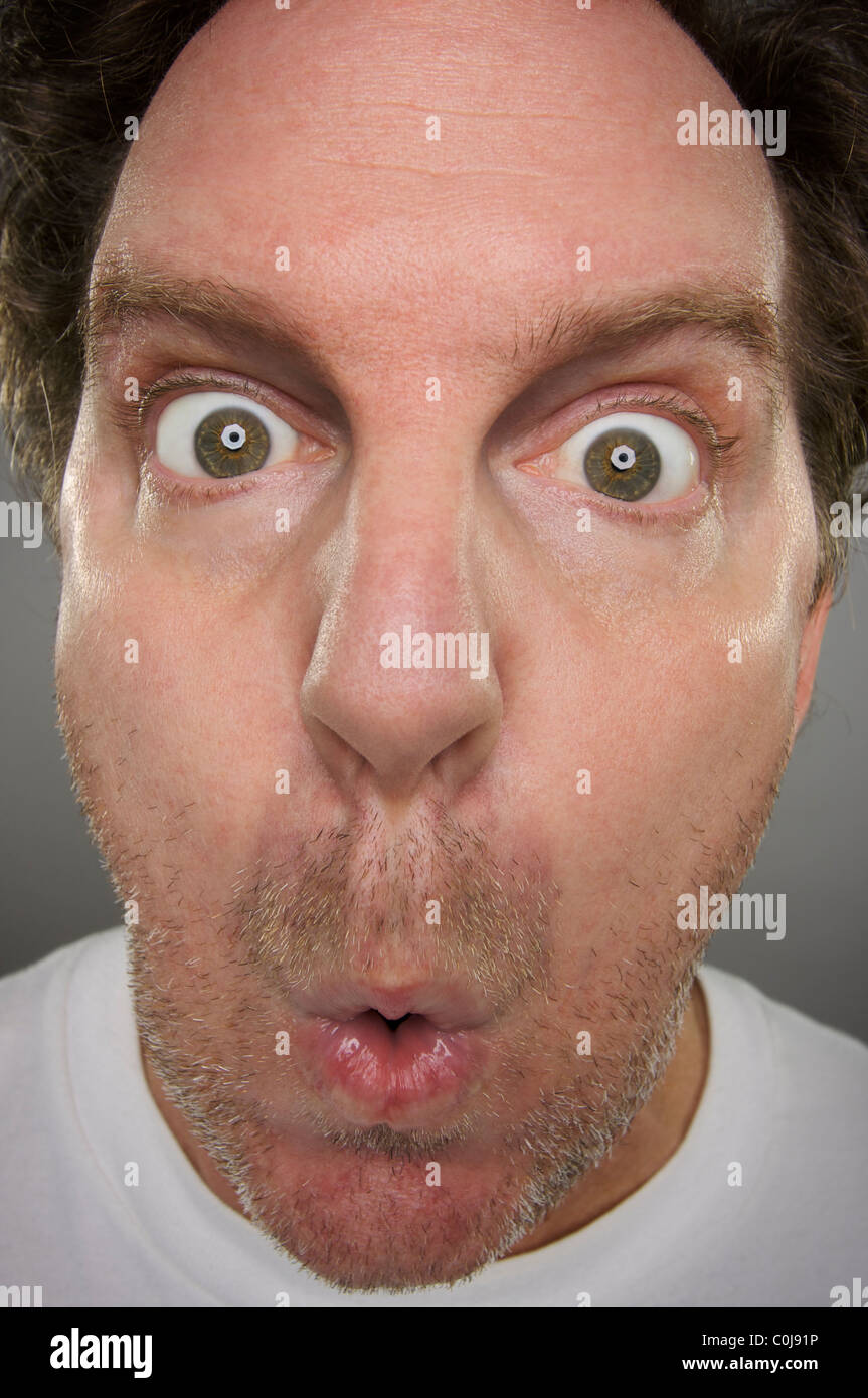Surprised Man with bright, wide eyes Stock Photo - Alamy