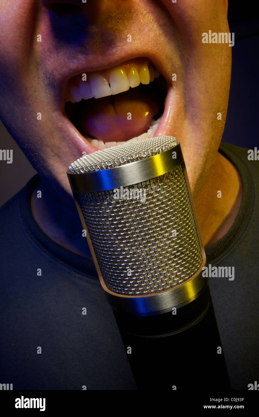 Passionate Male Vocalist & Microphone Stock Photo - Alamy
