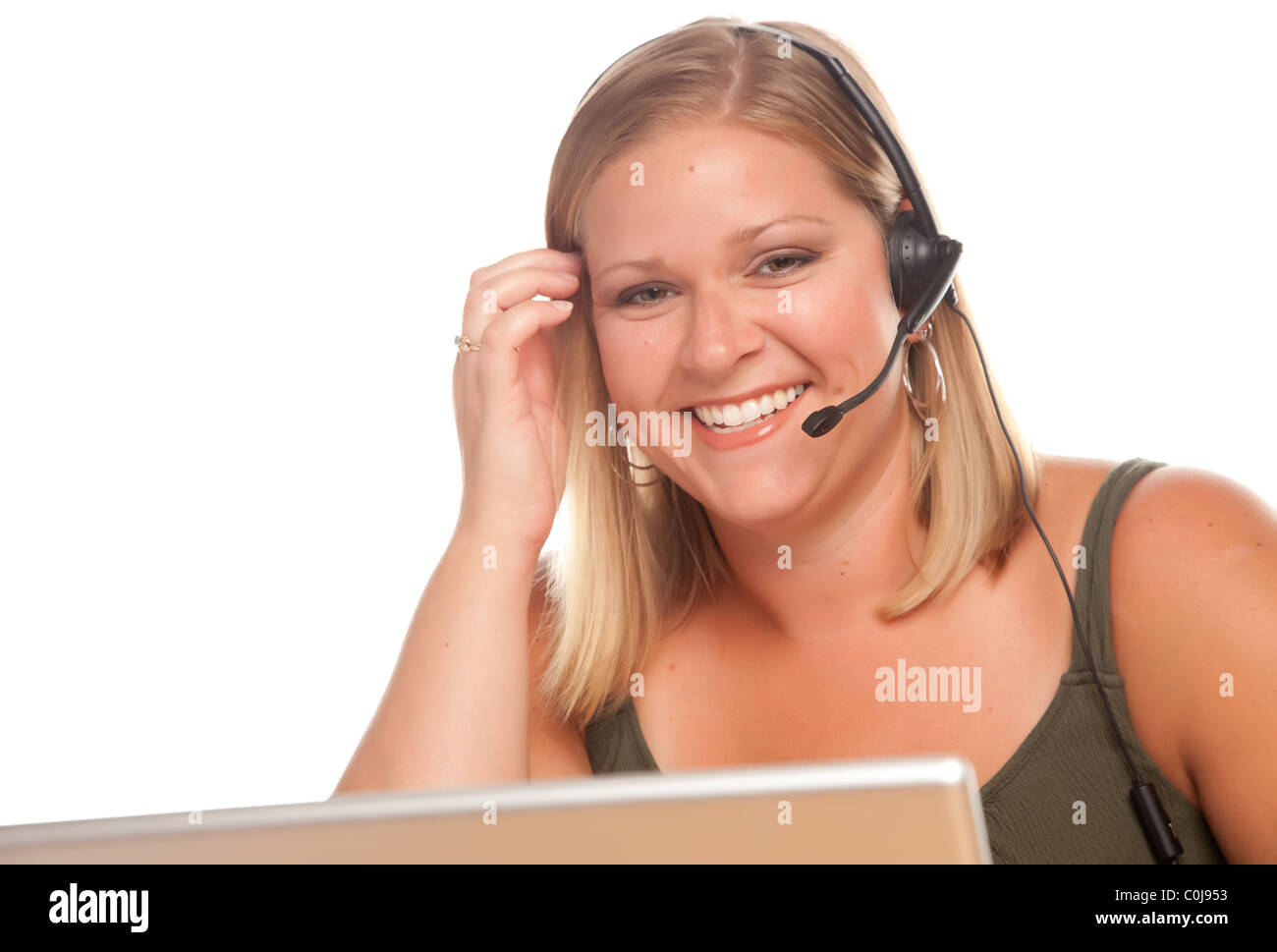 Attractive businesswoman smiles as she talks on her phone headset hi ...