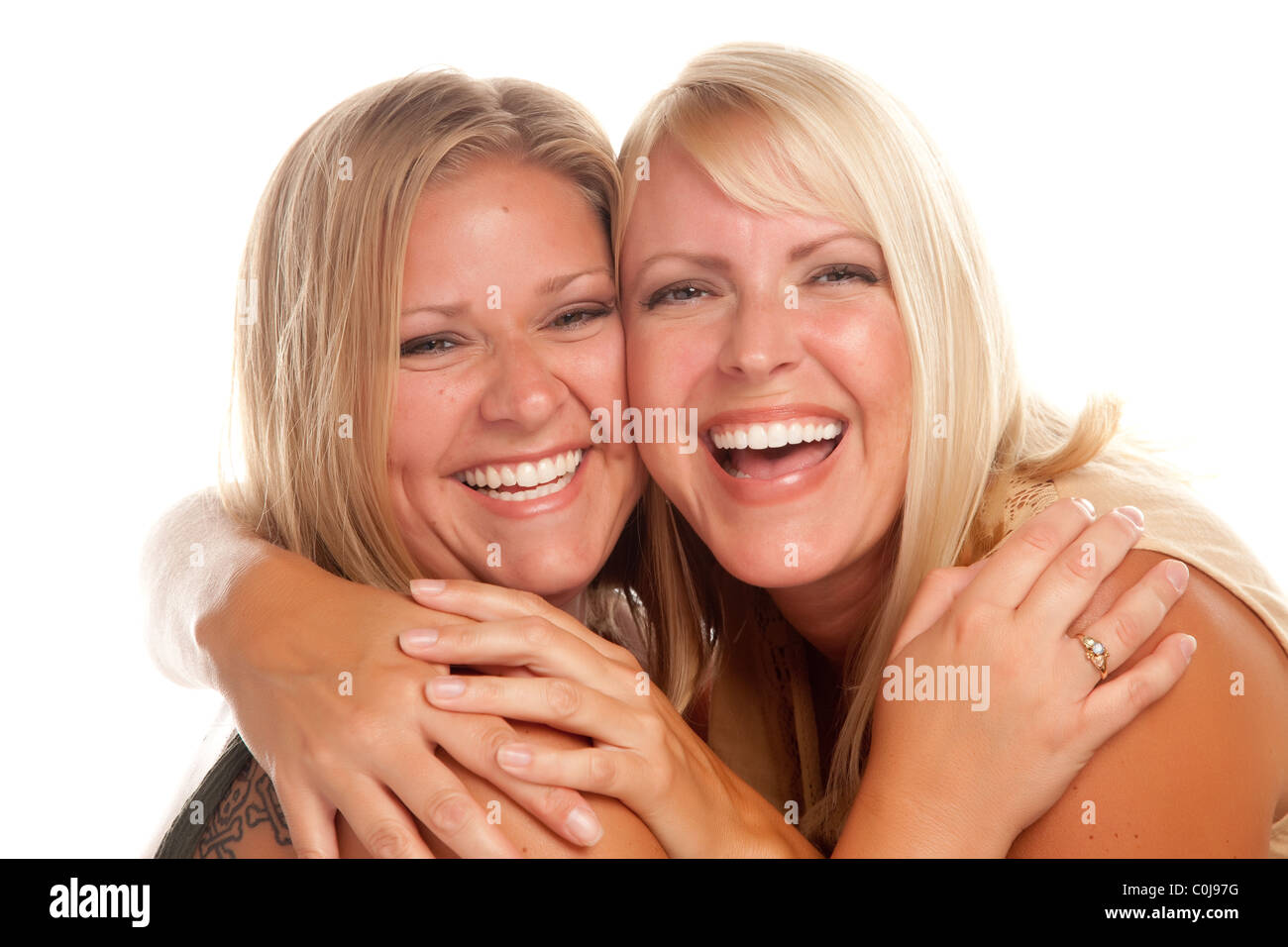 Two Beautiful Sisters Embracing Isolated on a White Background Stock ...