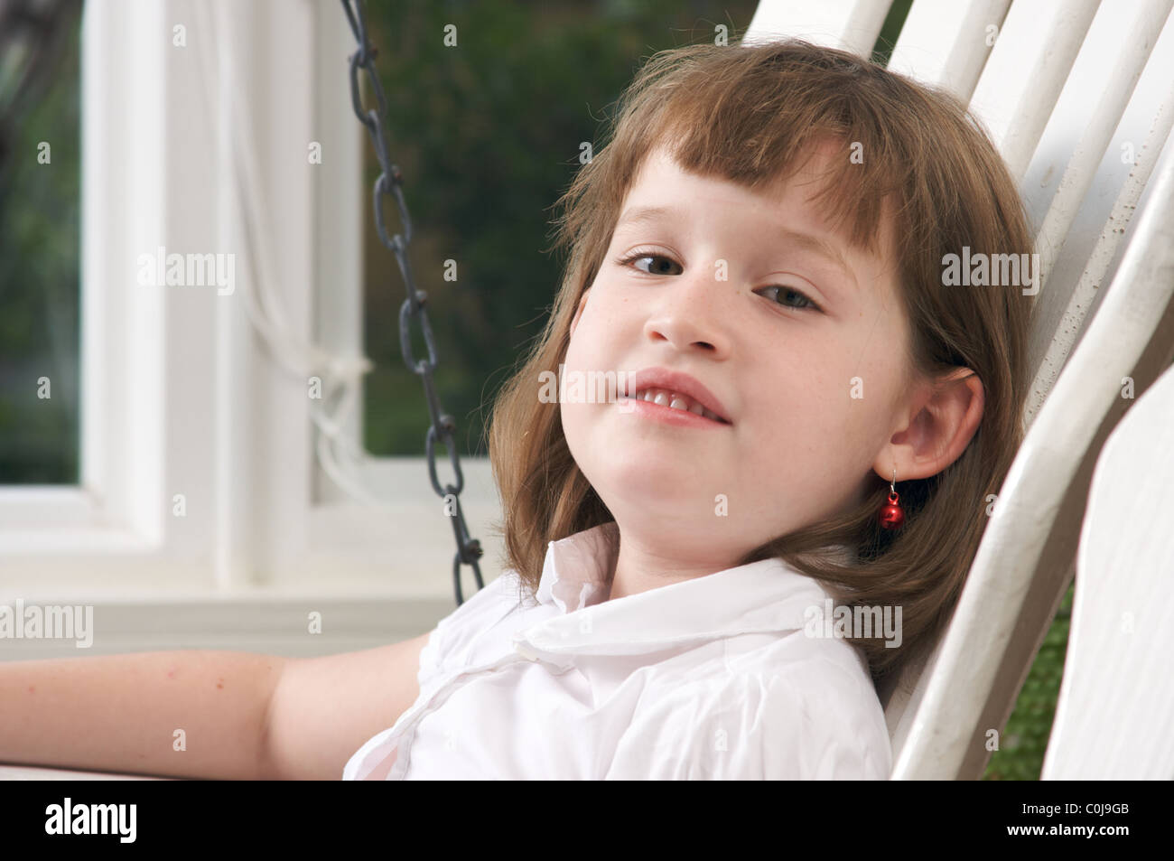 Adorable Girl Poses for a Fun Portrait Stock Photo - Alamy