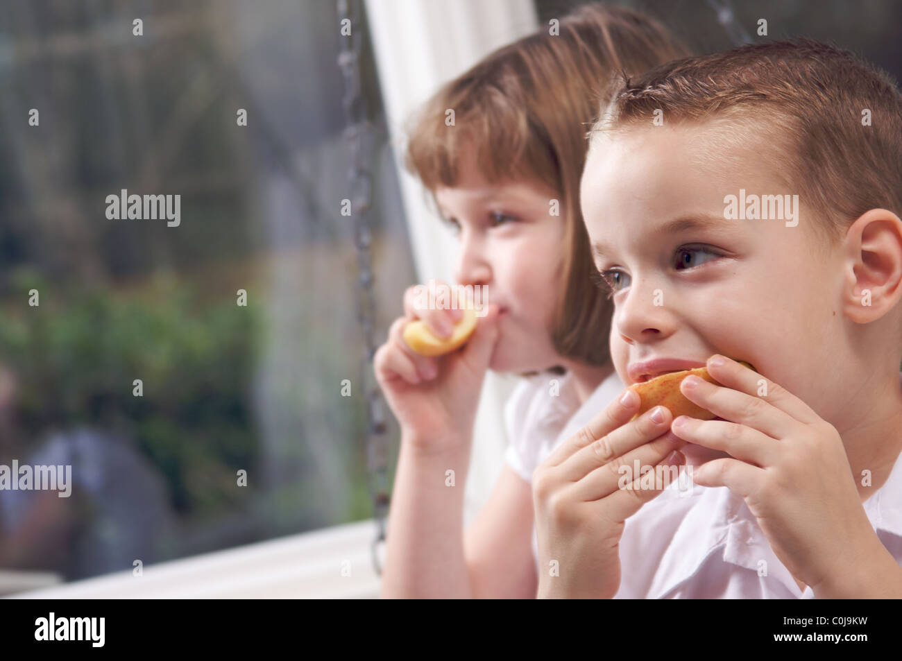 Beautiful boy eating apple hi-res stock photography and images - Alamy