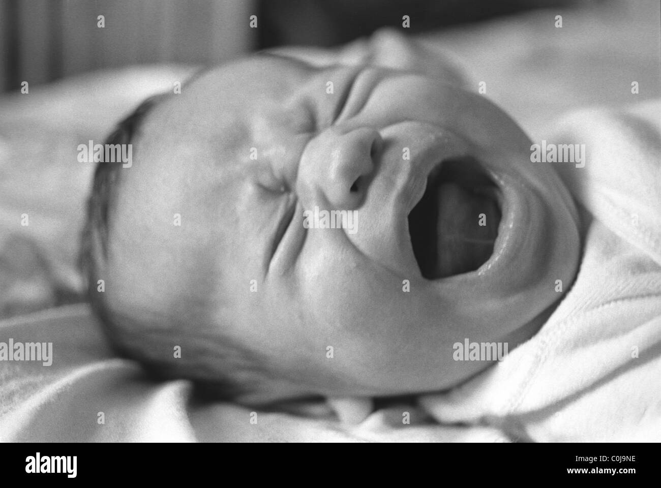 Baby girl crying Black and White Stock Photos & Images - Alamy