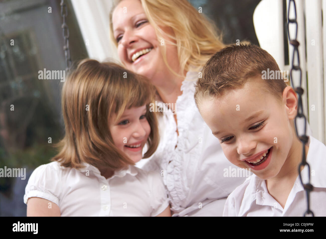 Mother and Her Two Children Enjoying a Fun Moment Stock Photo - Alamy