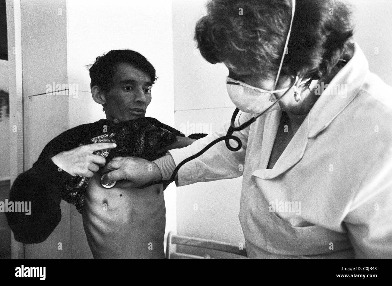 Moynaq, Uzbekistan. A man with tuberculosis (TB) is checked by a doctor ...