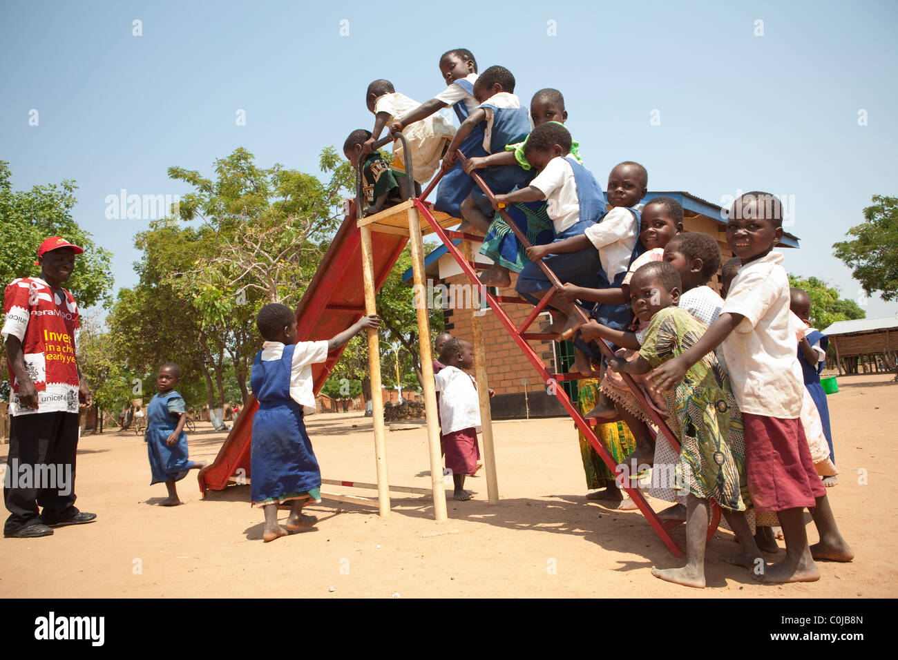 Children play at a centre for orphans and vulnerable children funded by ...
