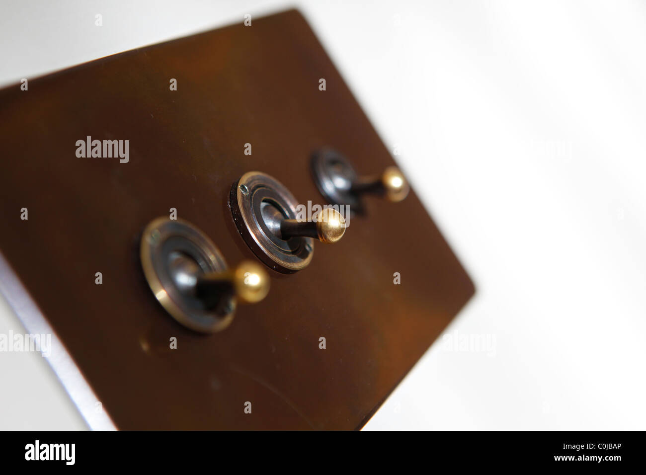 Traditional light switch in a room on a white wall Stock Photo - Alamy