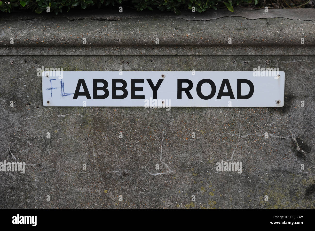 Someone has drawn the letters fl to Abbey Road sign in Brighton making ...