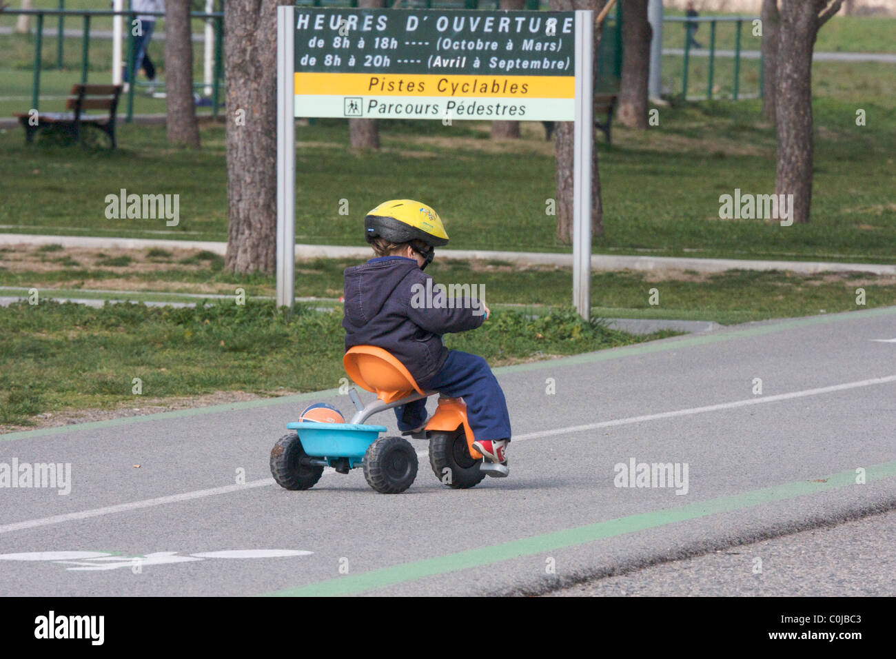 Child driving tricycle on cycle track Stock Photo - Alamy