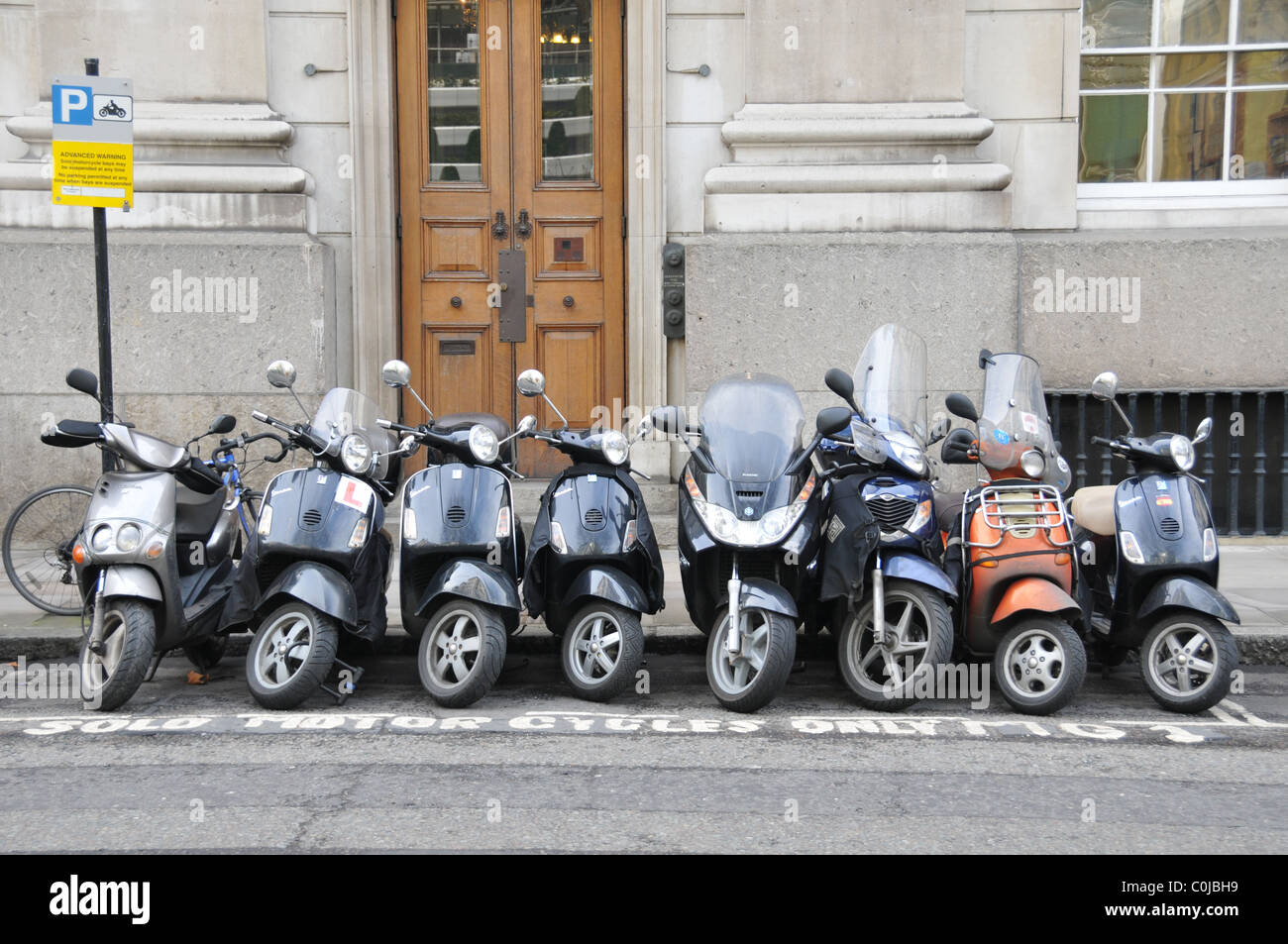 Scooters parked in City of London financial district Stock Photo - Alamy