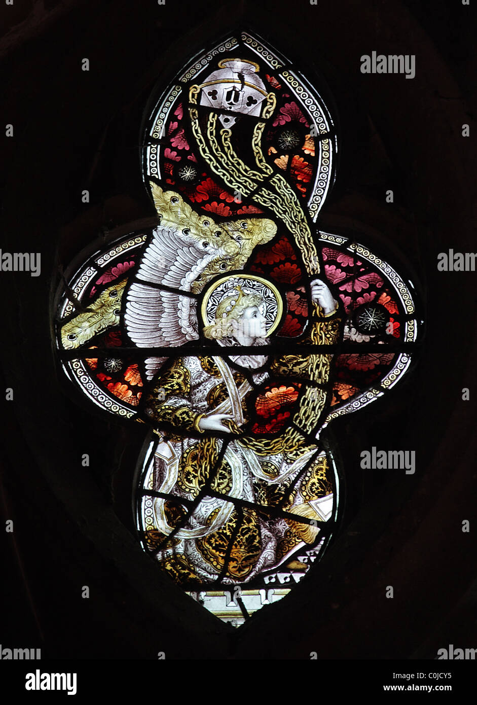 A stained glass window by C E Kempe & Co. depicting an angel swinging a ...