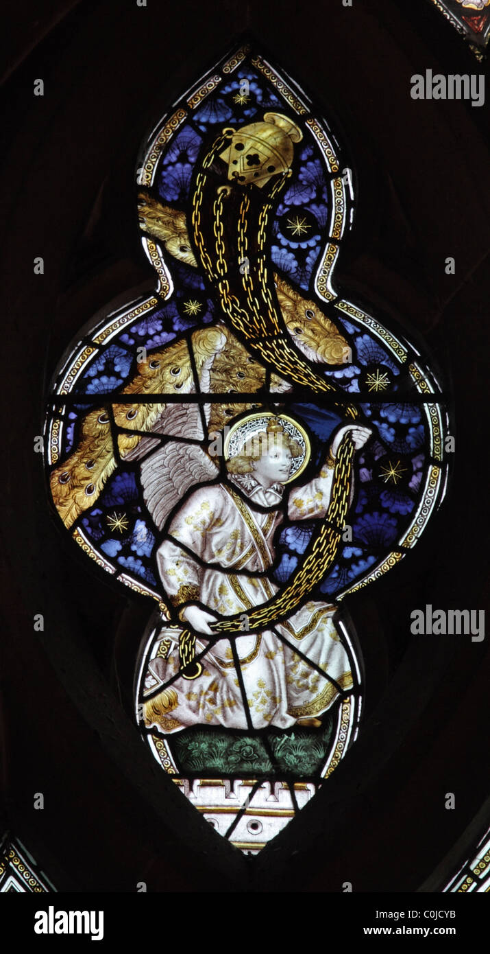 Stained glass window by C E Kempe & Co depicting an angel swinging an ...