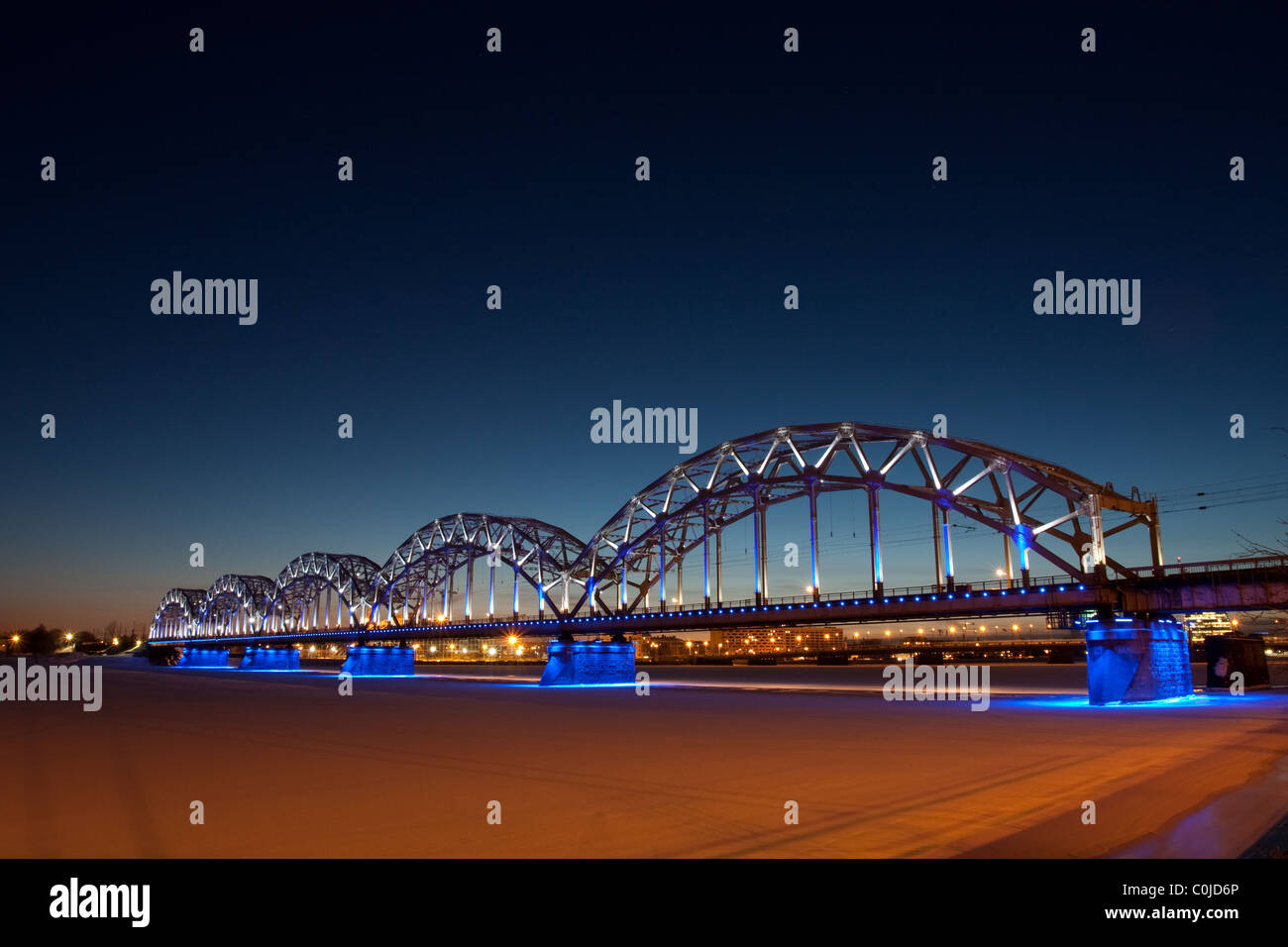 Railway bridge at night in winter close up Stock Photo - Alamy