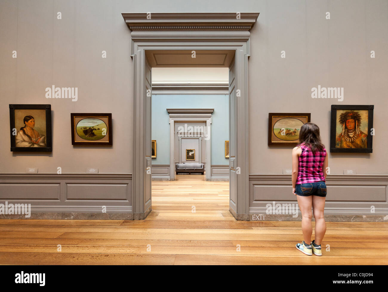 Person looking at art in the National Gallery of Art Building in ...