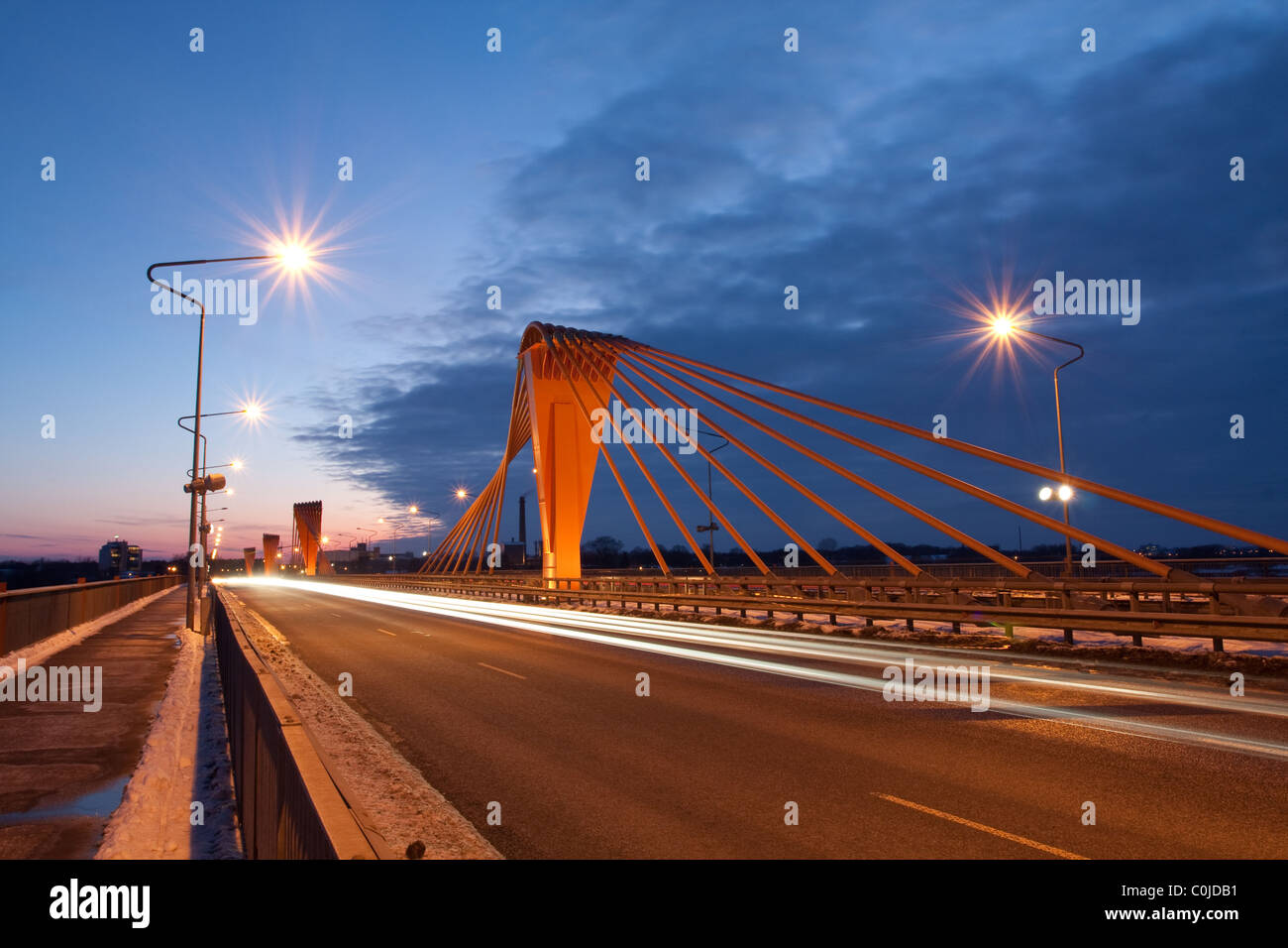 Cable bridge at evening with road close up Stock Photo - Alamy
