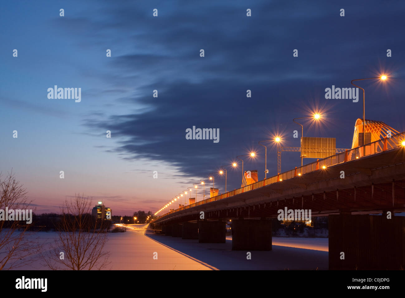 Bridge over the river at night wide Stock Photo - Alamy