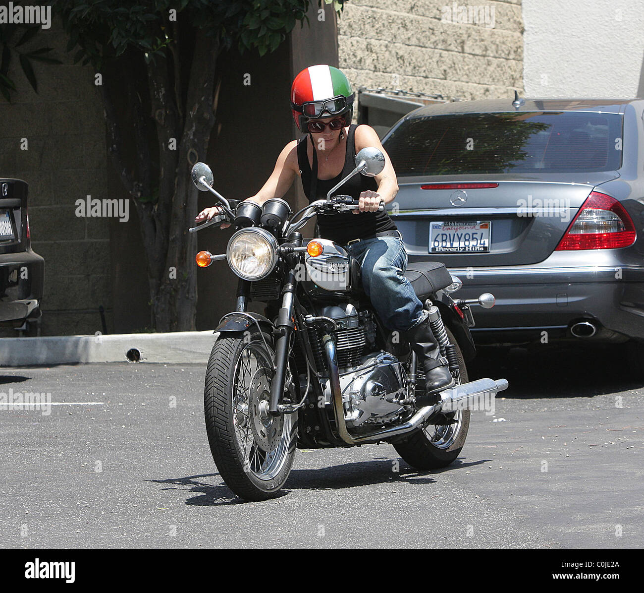 Pink aka Alecia Moore looking very butch as she cruises on her Triumph ...