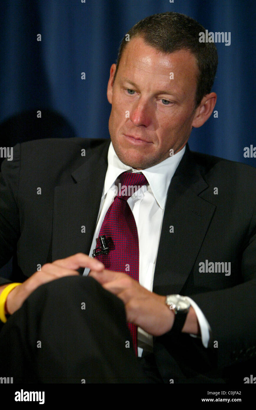 Lance Armstrong speaking at the press conference for his foundation ...