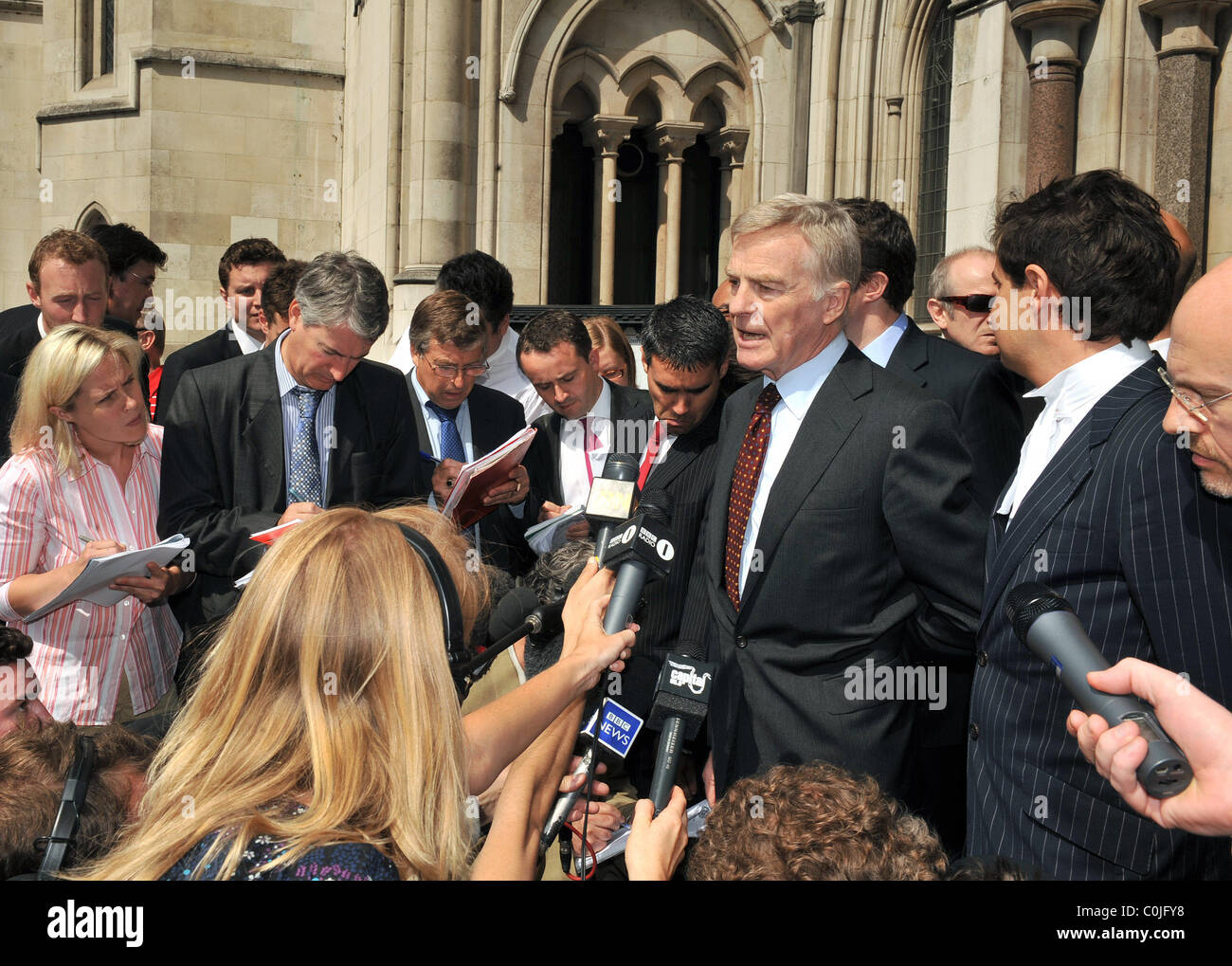 FIA boss Max Mosley leaves the Royal Courts of Justice in London ...