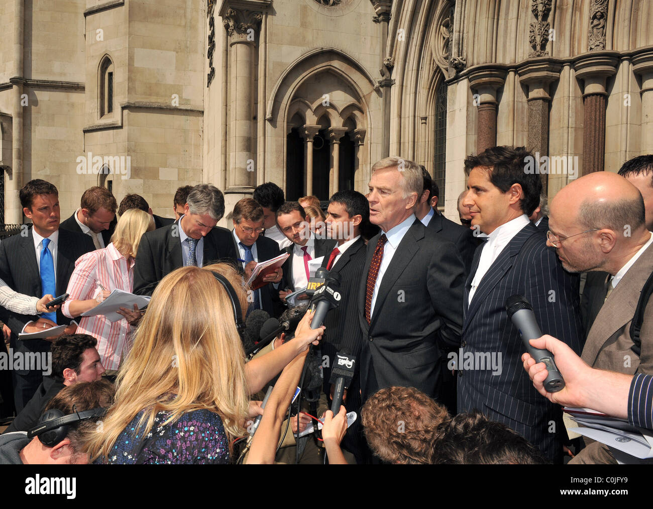 FIA boss Max Mosley leaves the Royal Courts of Justice in London ...