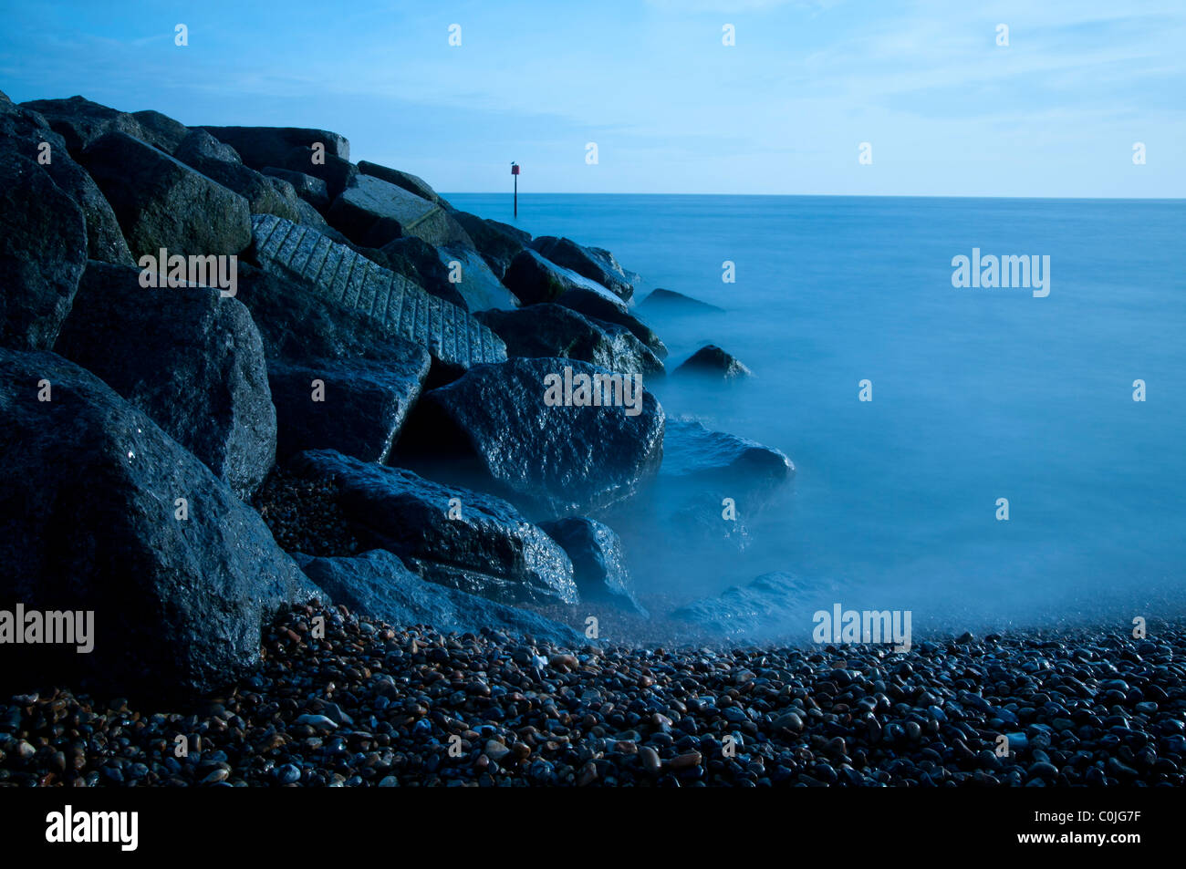 Water and Rocks on the beach Folkestone kent england UK Stock Photo - Alamy