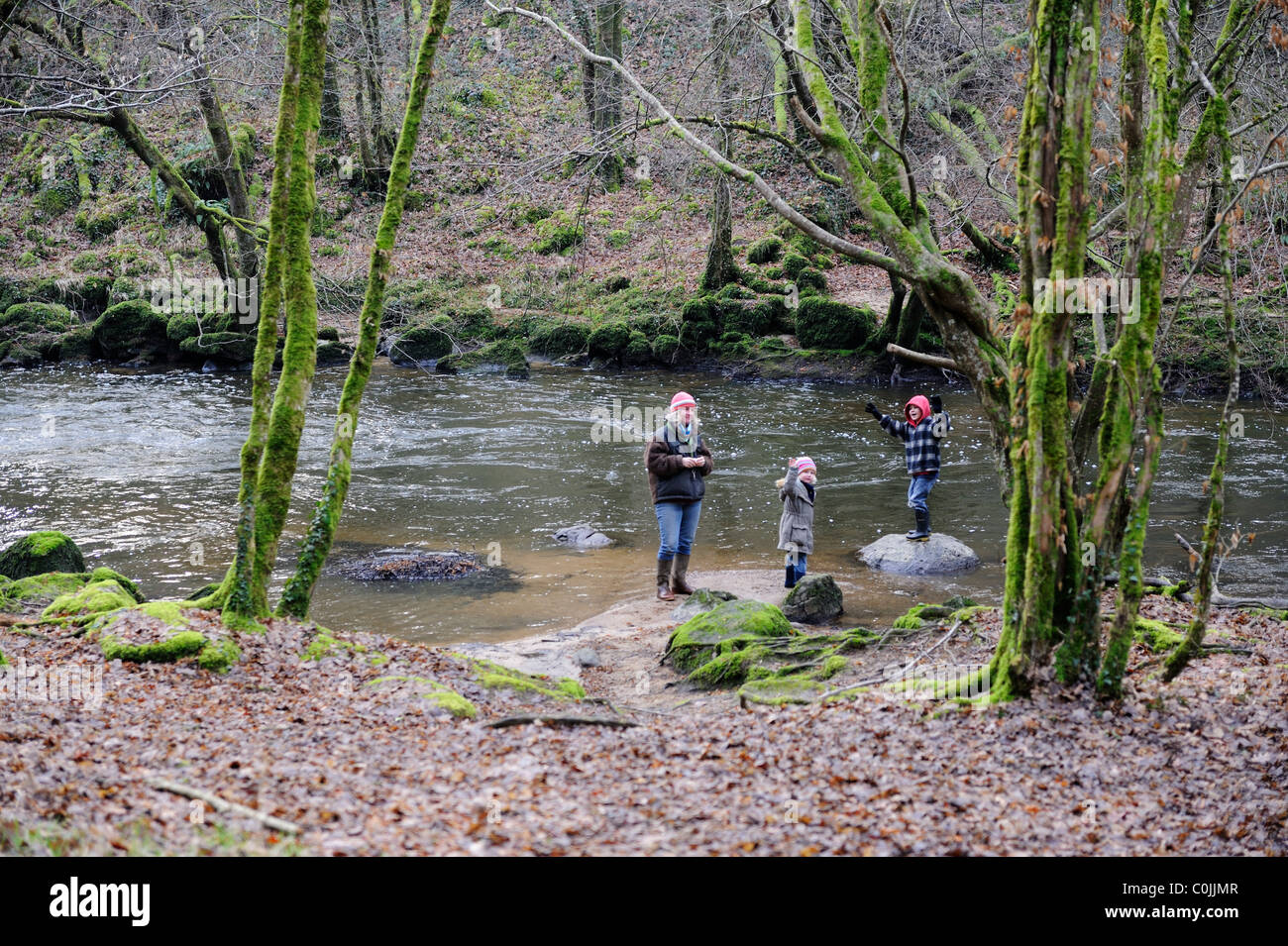 Stock photo of a mother and her children out on a winter walk in the ...