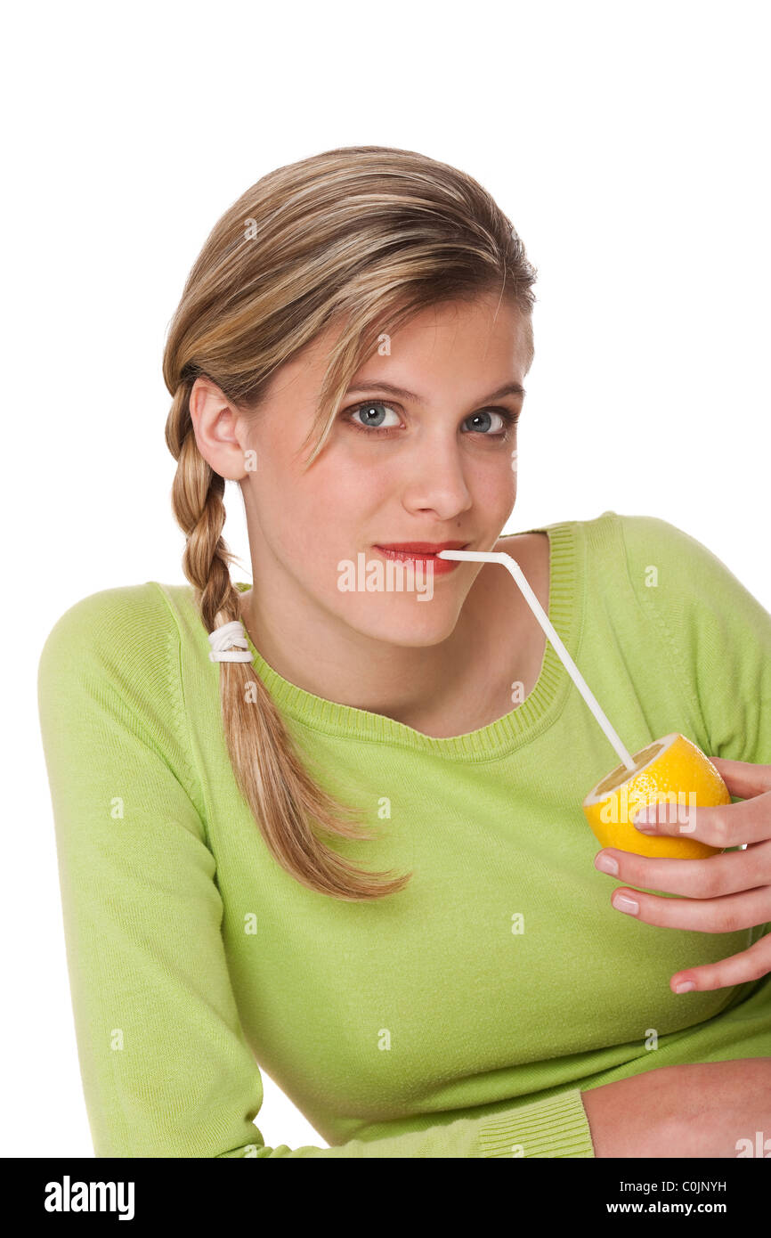 Woman holding lemon with straw on white background Stock Photo - Alamy