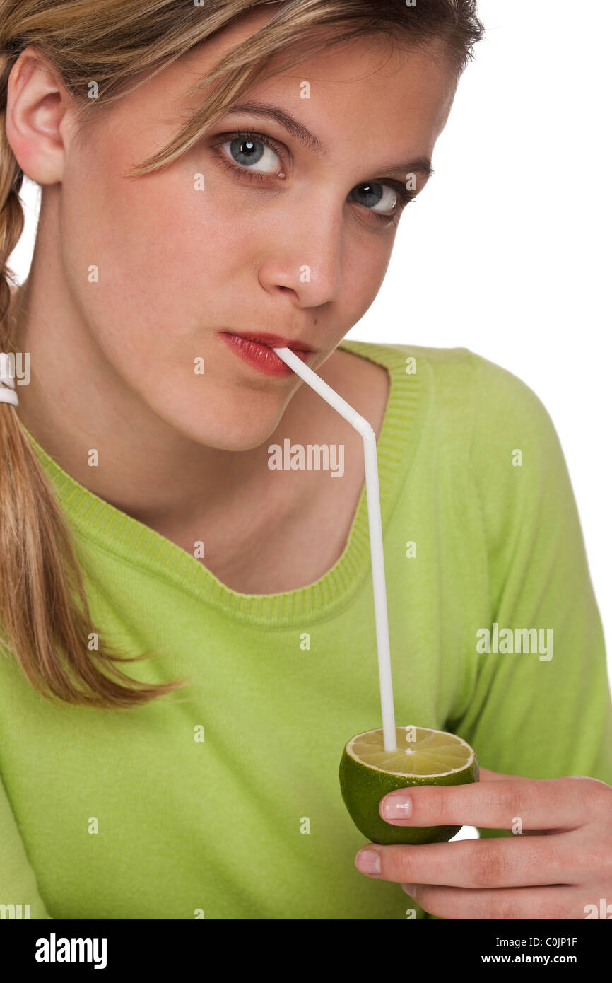 Woman drinking lime on white background Stock Photo - Alamy